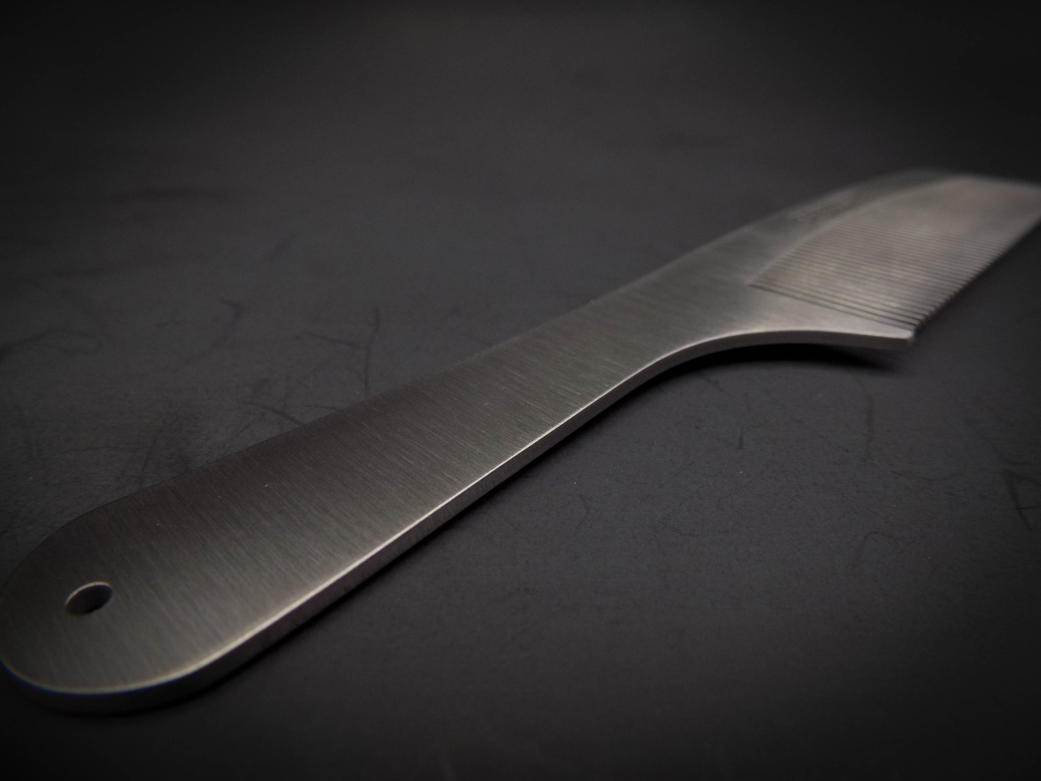 Steeltooth Comb - A comb for thick hair, beards, and pomade.